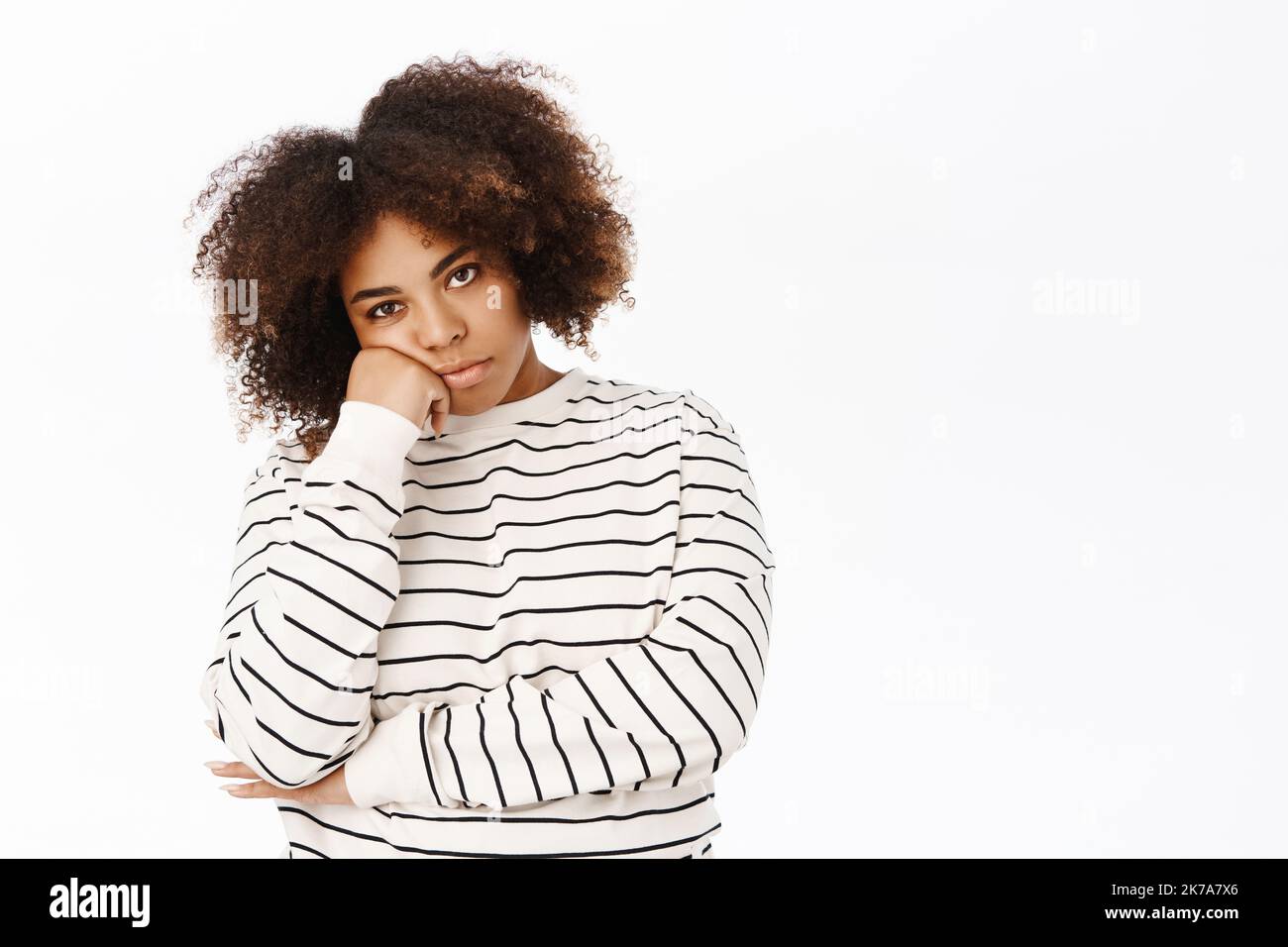 Bored and upset african american woman, looking with indifference at ...