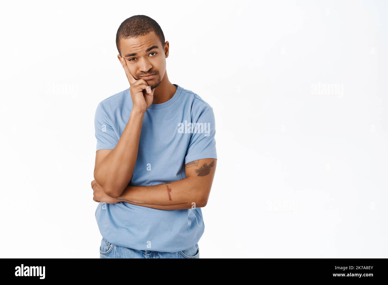 Portrait of man looking bored and uninterested, standing unamused ...