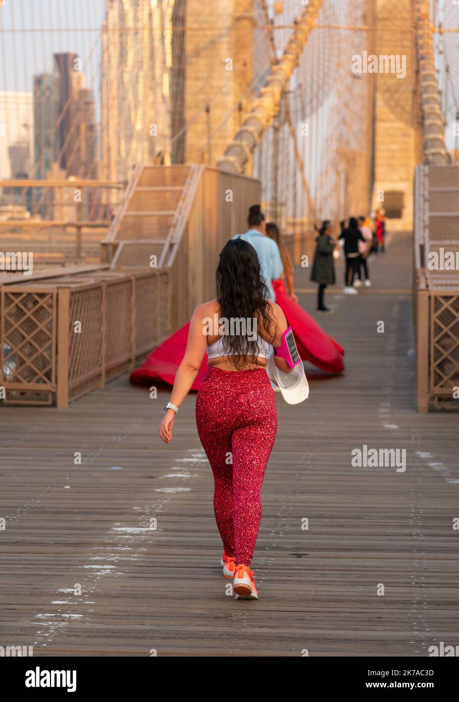 New York City, United States - September 18, 2022 A girl in bright red ...