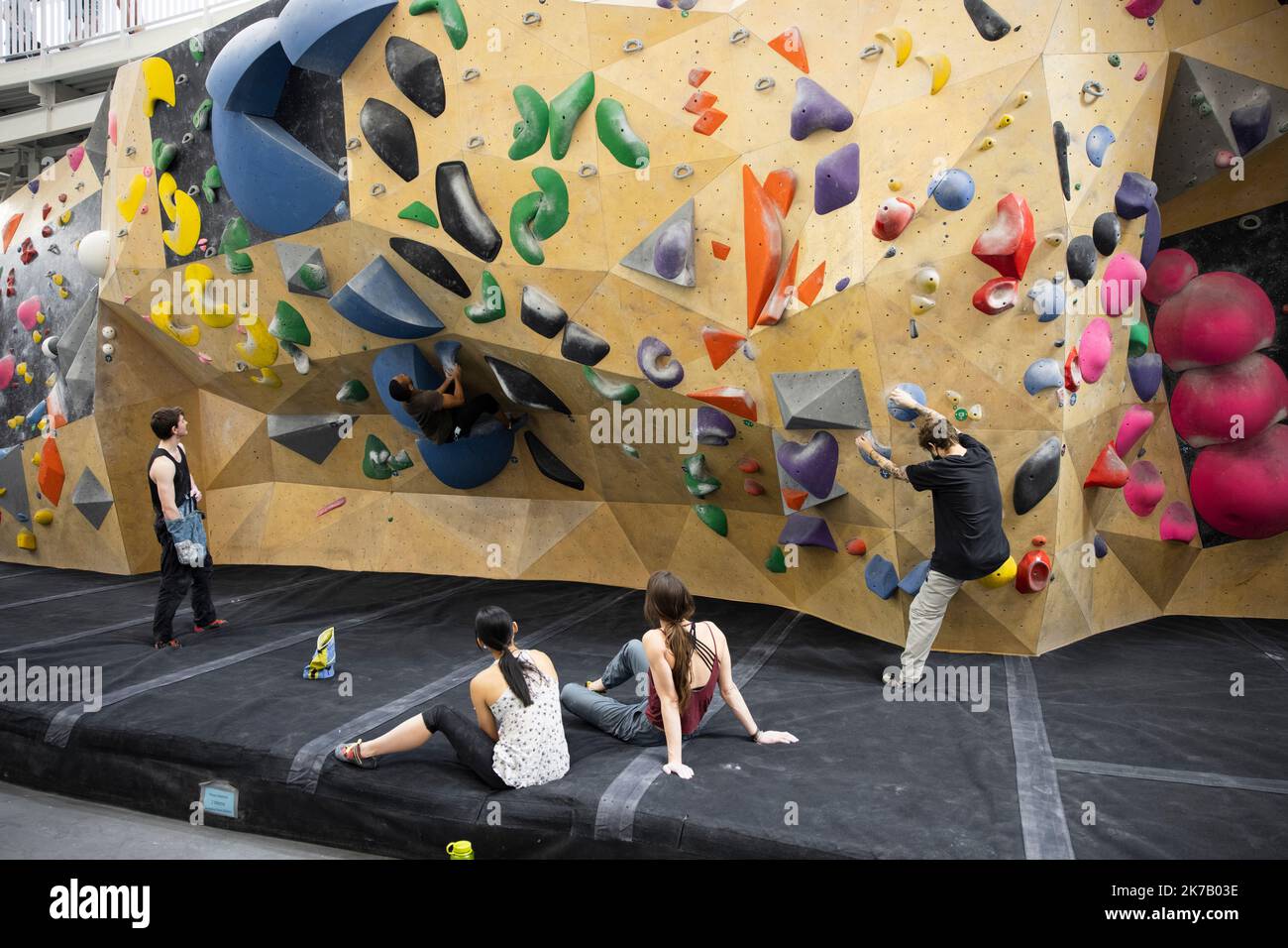 Young climbers at wall in climbing gym Stock Photo - Alamy