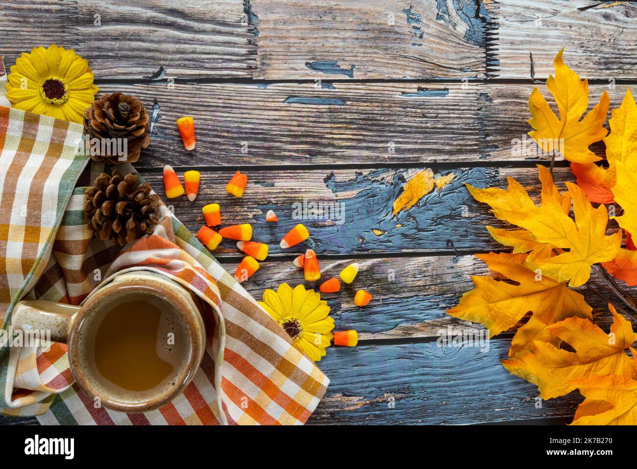 Cozy autumn fall arrangement flatlay with coffee, candy corn, maple ...