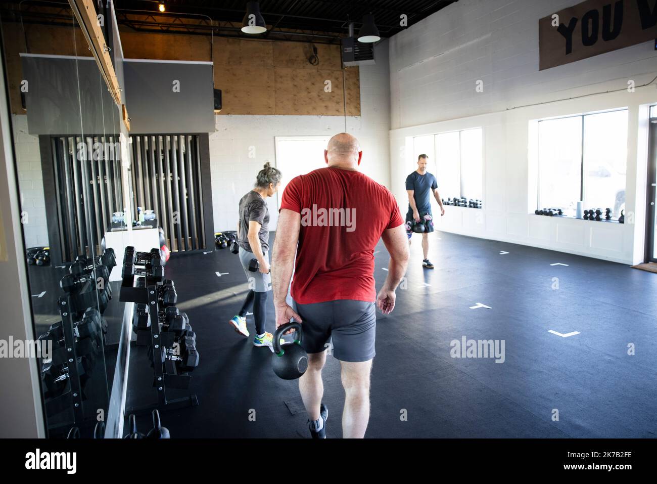 Man carrying weight hi-res stock photography and images - Alamy