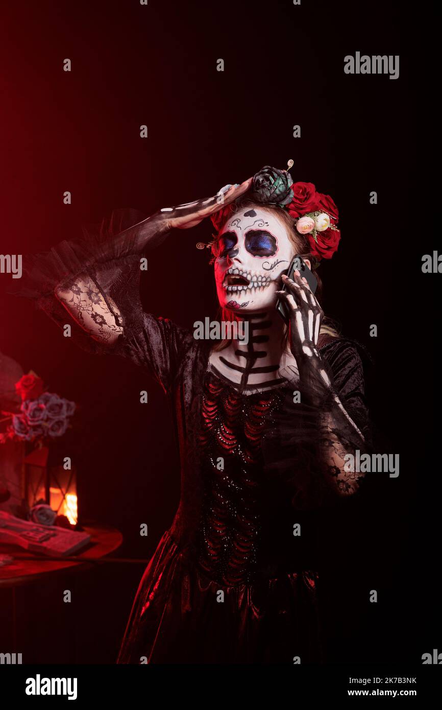 Scary lady talking on phone call with smartphone, wearing flower crown ...