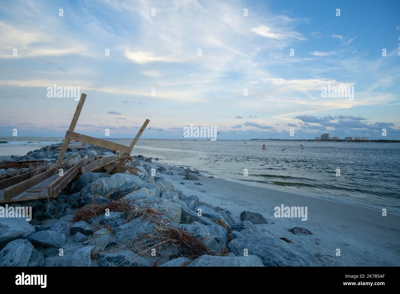 Wreckage from the jetty boardwalk sits next to the ocean at the Ponce ...