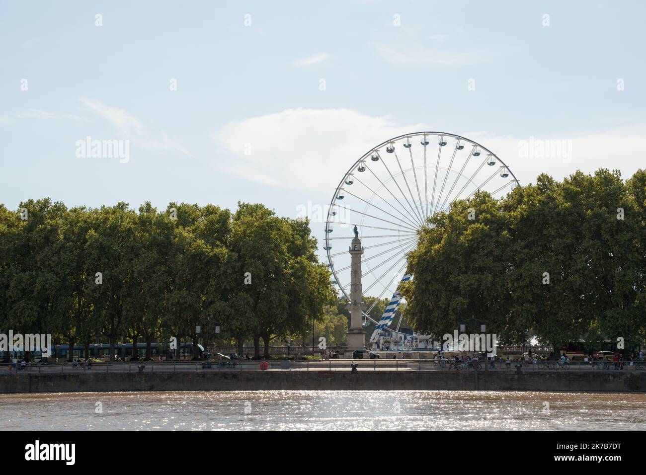 Bordeaux, France; 08092022: Fair ferris wheel at Bordeaux park. Water ...