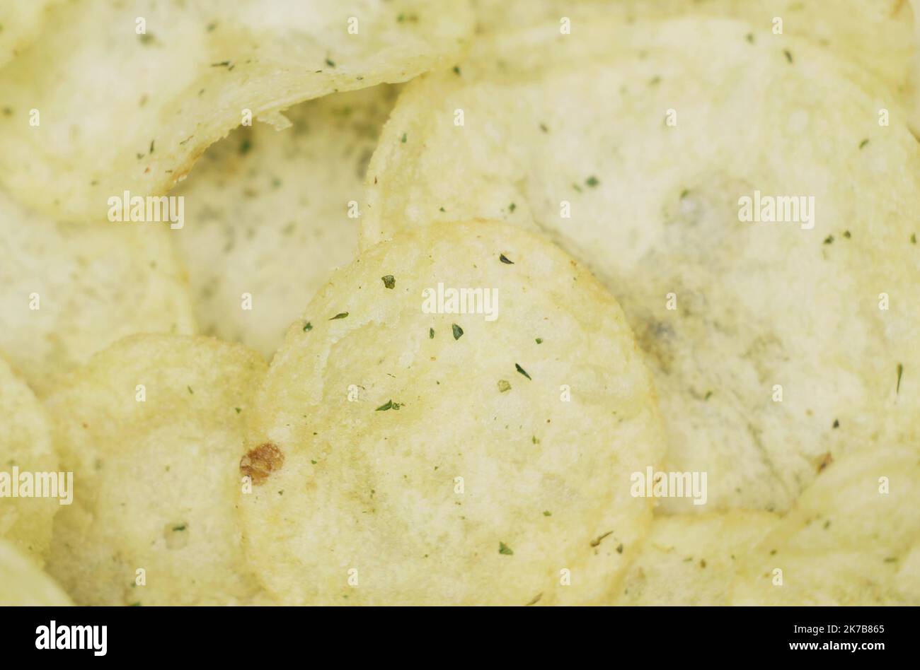 Potato chips on a rotating surface. Close-up. Food Stock Photo - Alamy