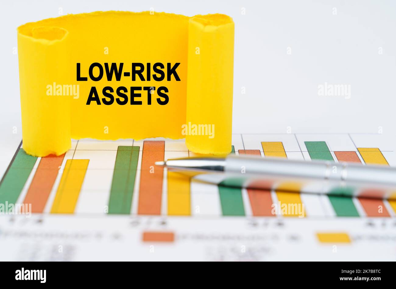 Business concept. On the business charts are a pen and a paper plate ...
