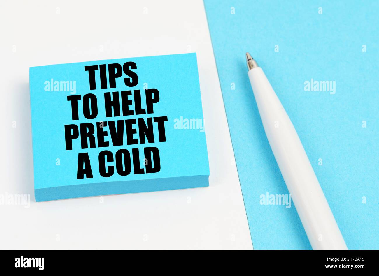 Medical concept. On a white and blue surface, a pen and blue stickers ...