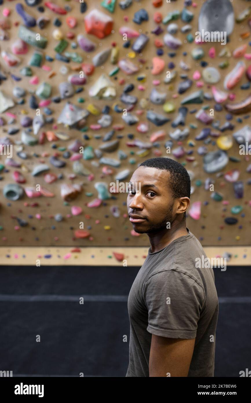 Man climbing over wall hi-res stock photography and images - Alamy