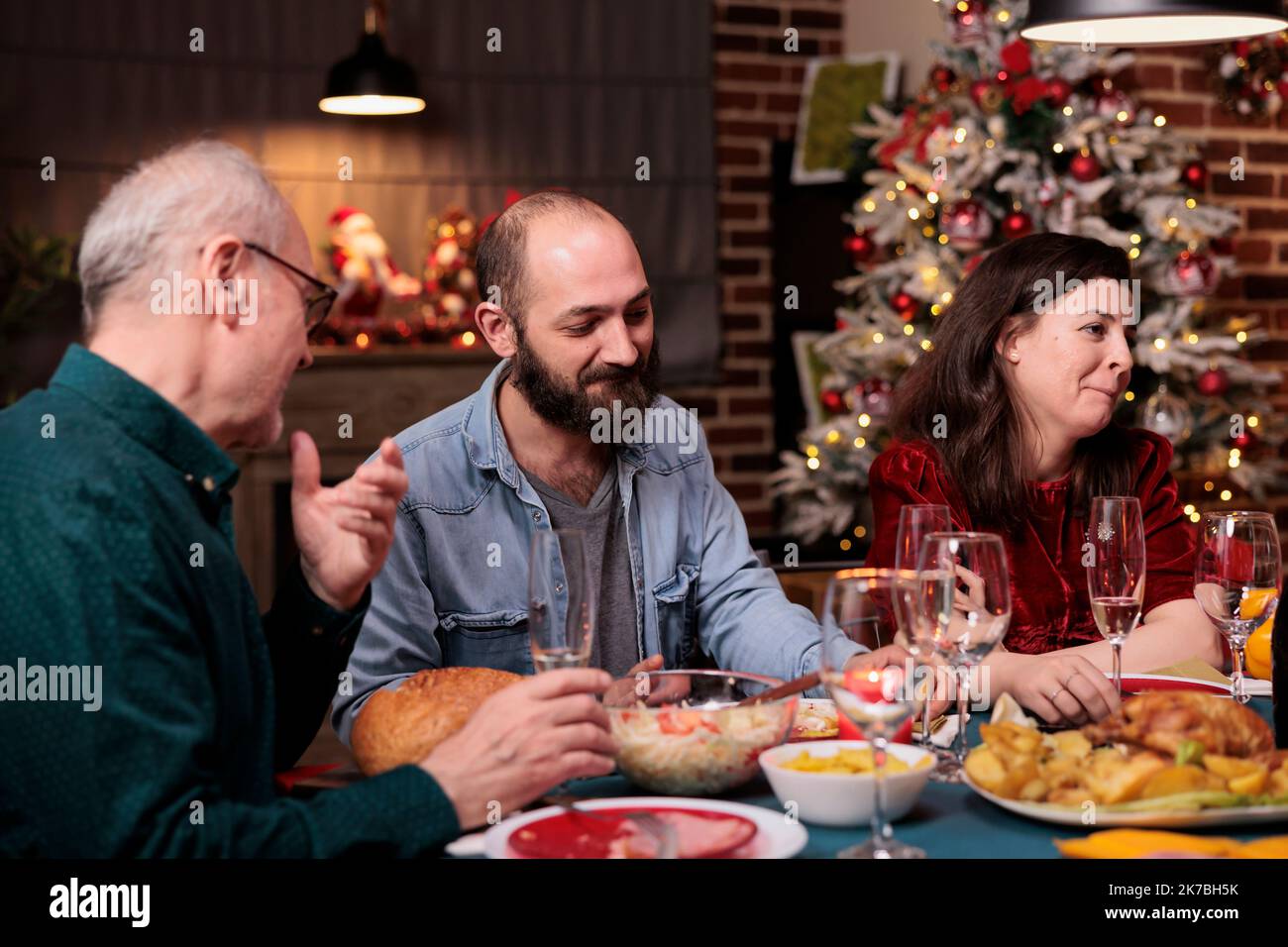 Family chatting sitting festive table hi-res stock photography and ...