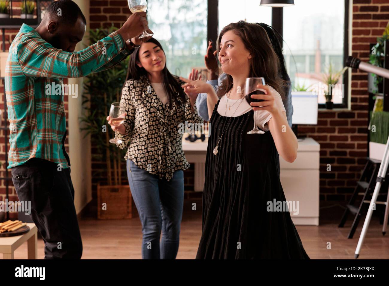 Caucasian young adult woman, girl happily dancing accompanied of ...