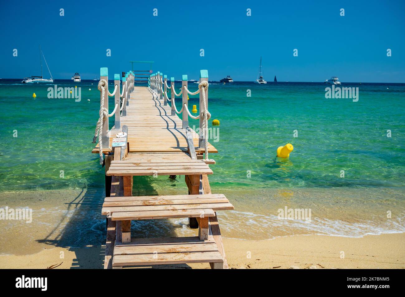 Wooden pier for guests of yachts on legendary Pampelonne beach near ...