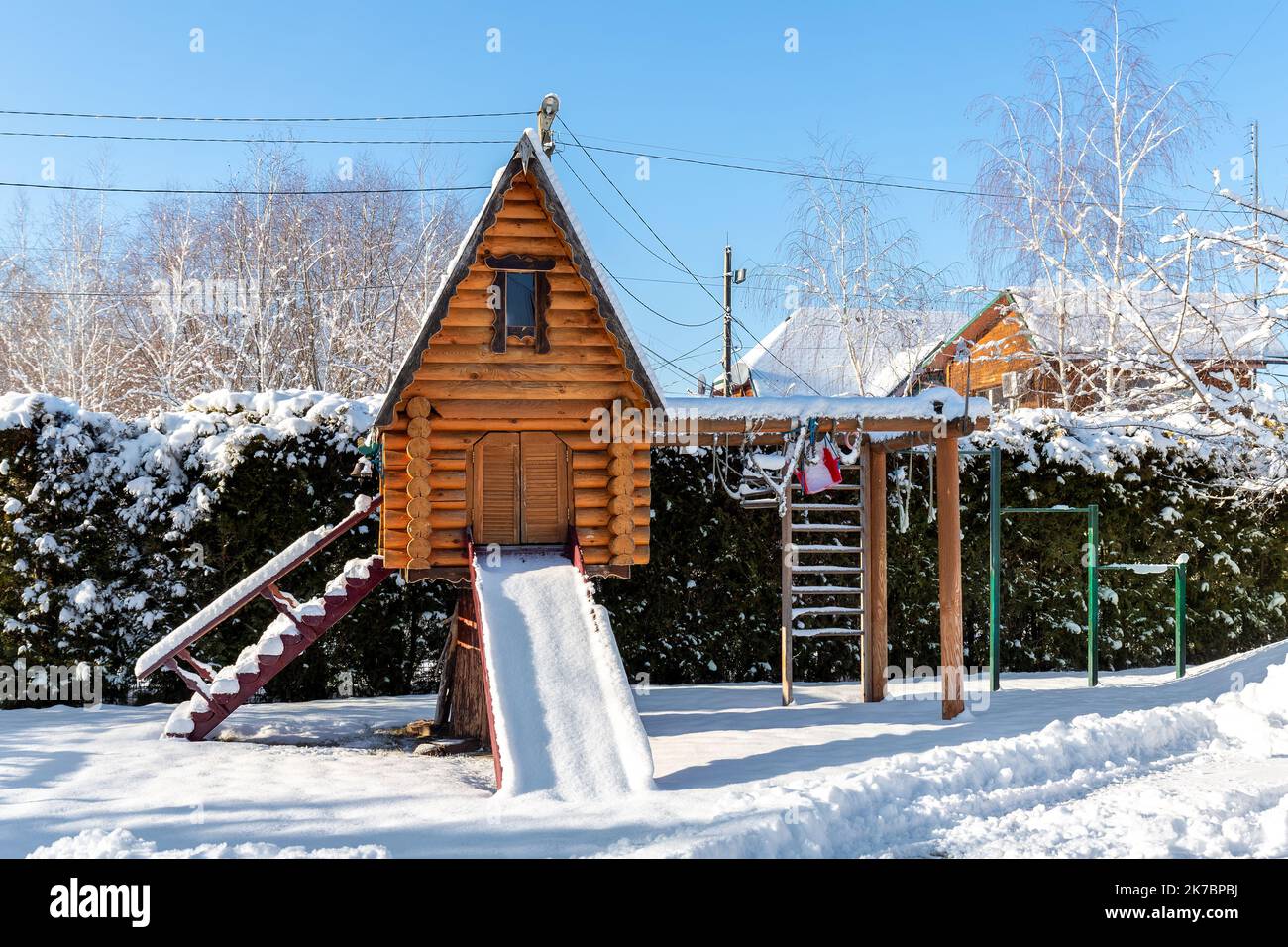 Small wood log playhouse teehouse hut snowcapped stairs ladder wooden ...