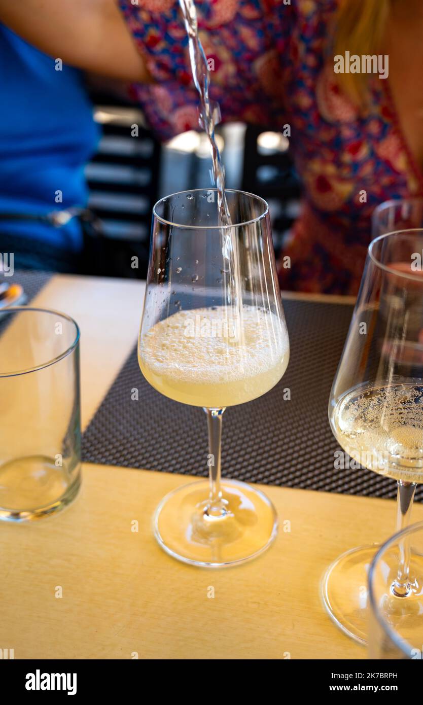 Drinking of txakoli or chacolí slightly sparkling very dry white wine ...