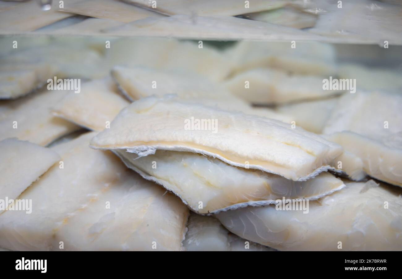 White salted and dried bacalao codfish in watertank, traditional ...