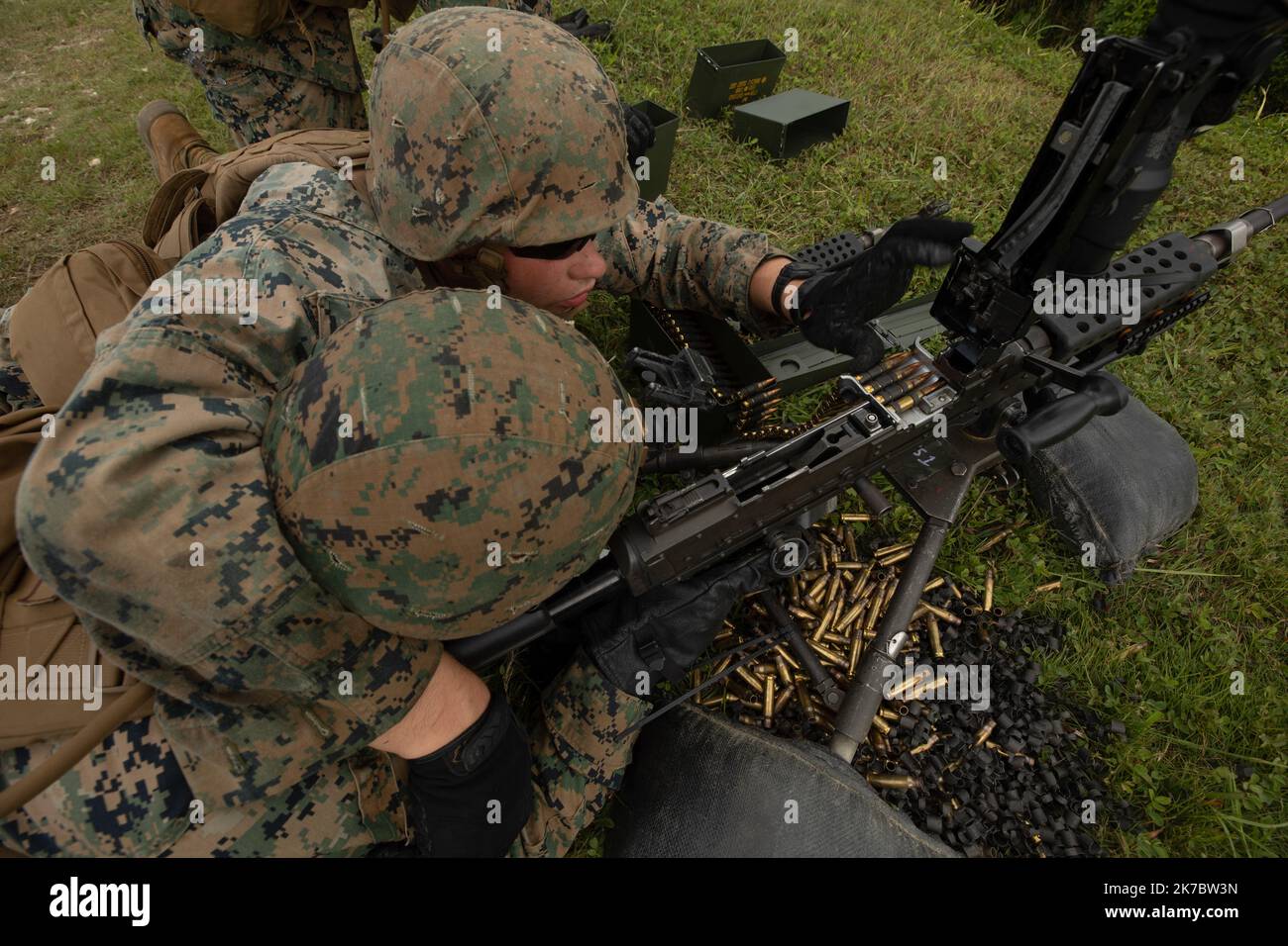 U.S. Marine Corps Lance Cpl. Tyler Belanger, top, a motor vehicle ...