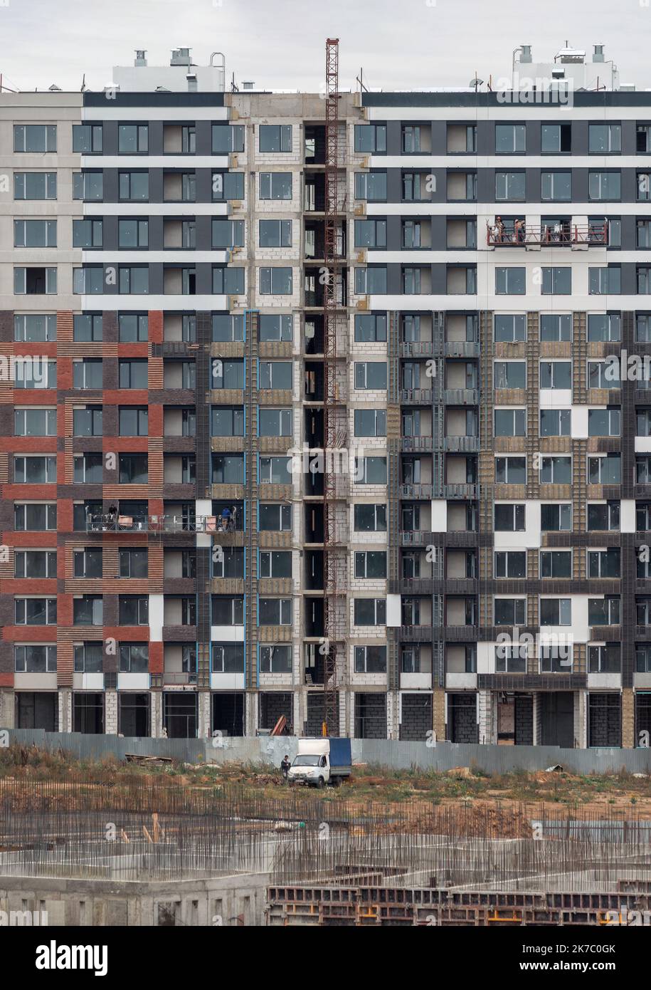 Construction of a residential building. View of the facade of an ...