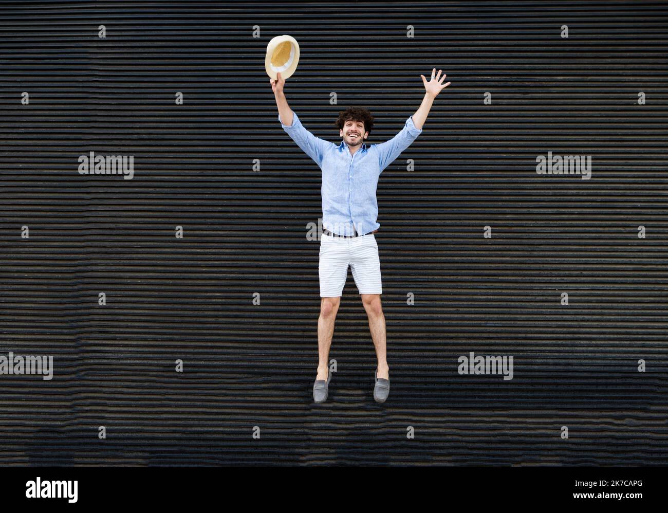 Young tourist man jumping for joy during vacation. Joy, vacation Stock ...