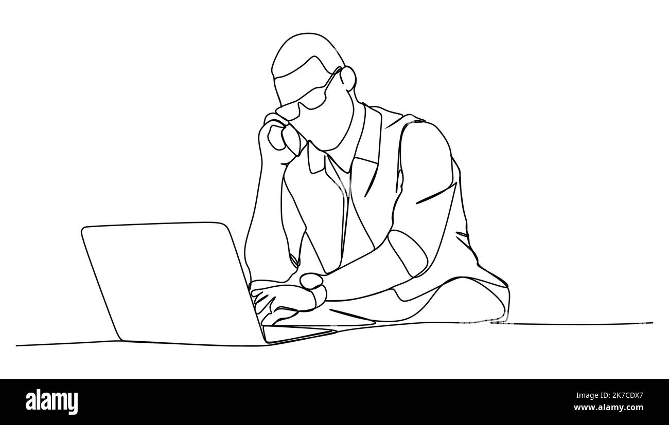 Busy young in front of laptop, making notes in notebook and talking to ...