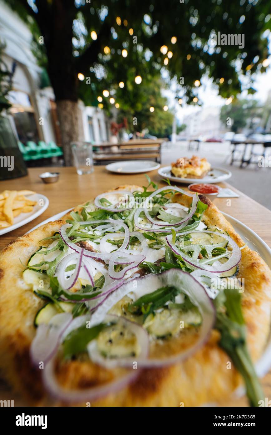 Vegetarian pizza in street fast food outdoor cafe Stock Photo - Alamy