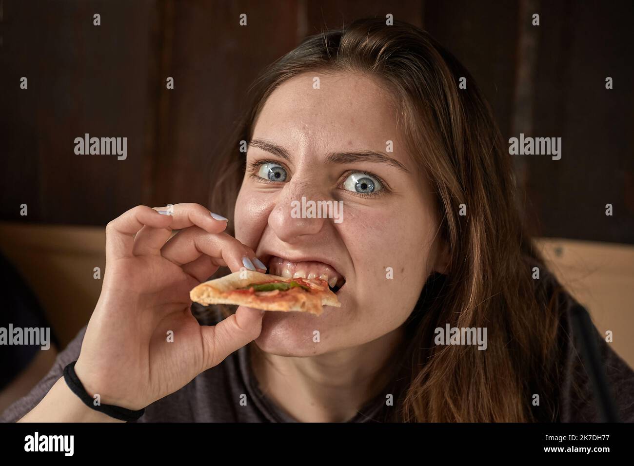 Girl eating pizza Stock Photo - Alamy