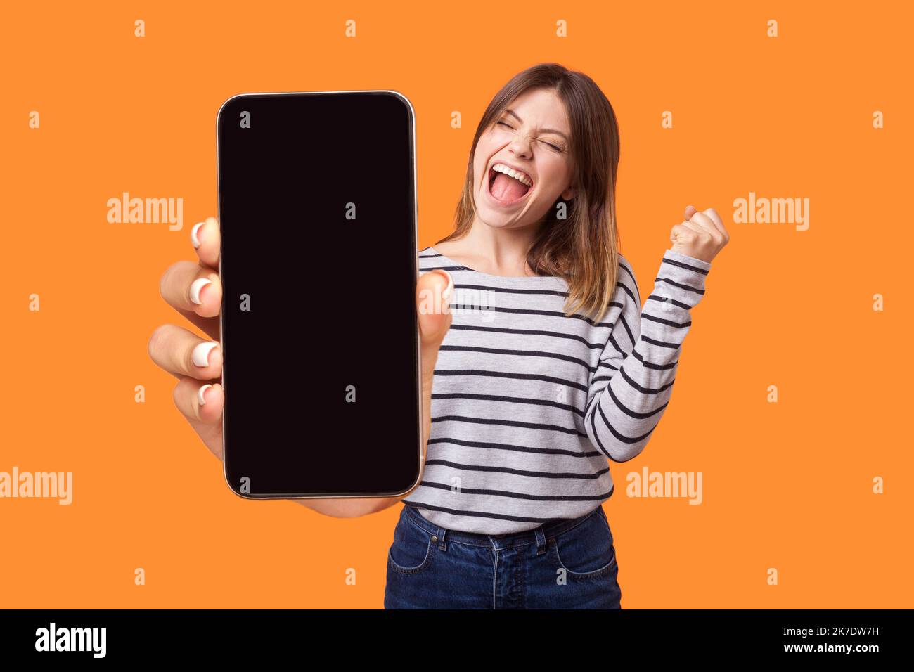 Portrait Of Happy Joyful Woman Wearing Striped Shirt Screaming With