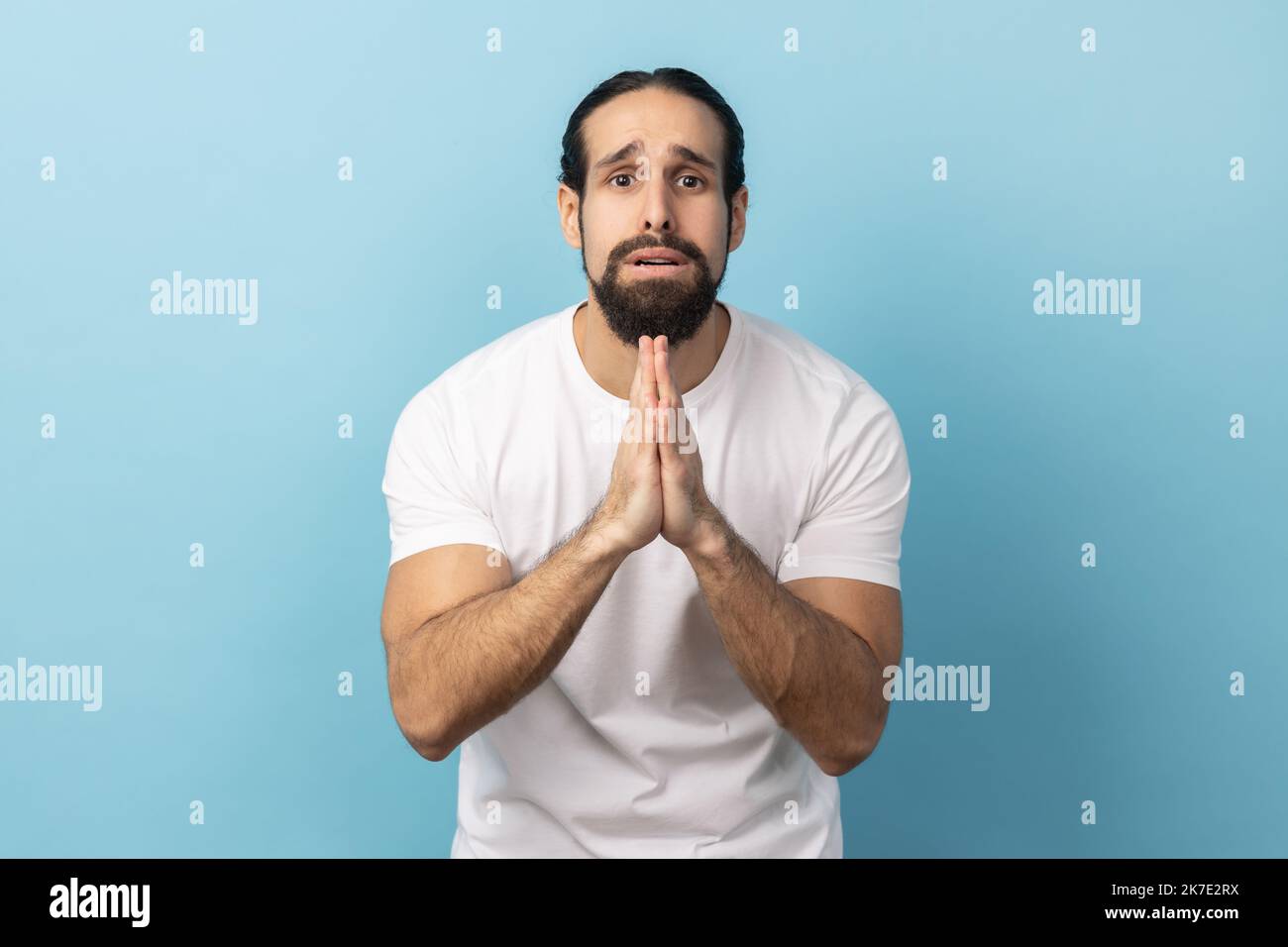 Please, I'm begging forgive. Portrait of upset worried man with beard ...