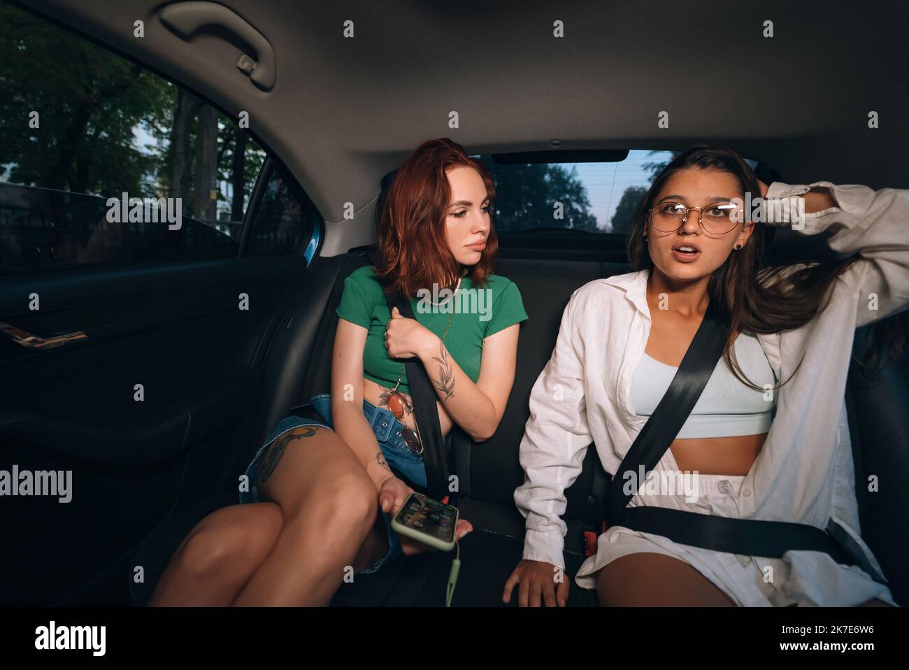 Friends in back seat car hi-res stock photography and images - Alamy