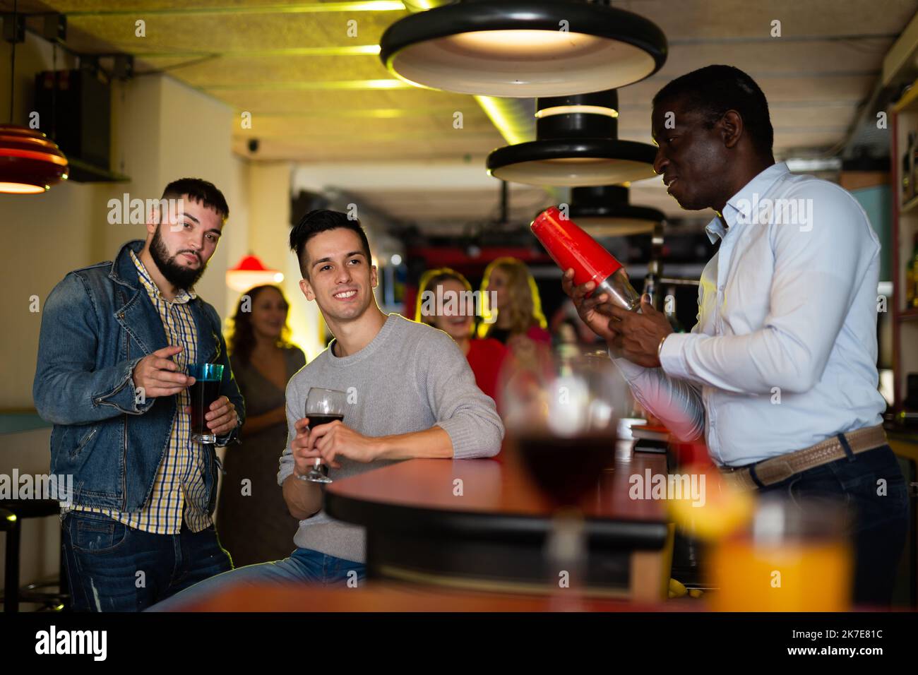 Group of male friends with alcohol in nightclub Stock Photo - Alamy
