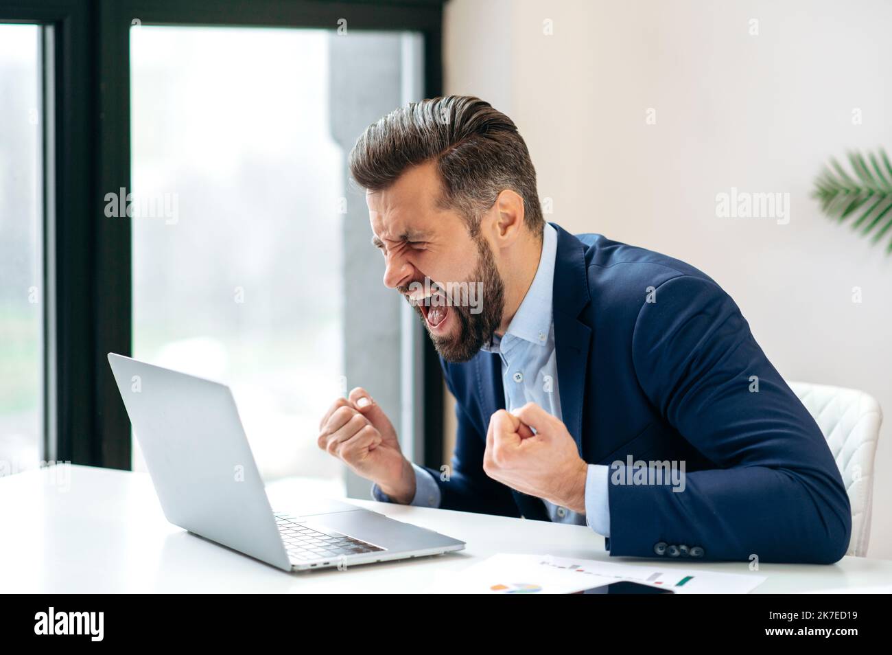 Angry annoyed frustrated caucasian business man, sitting at workplace ...