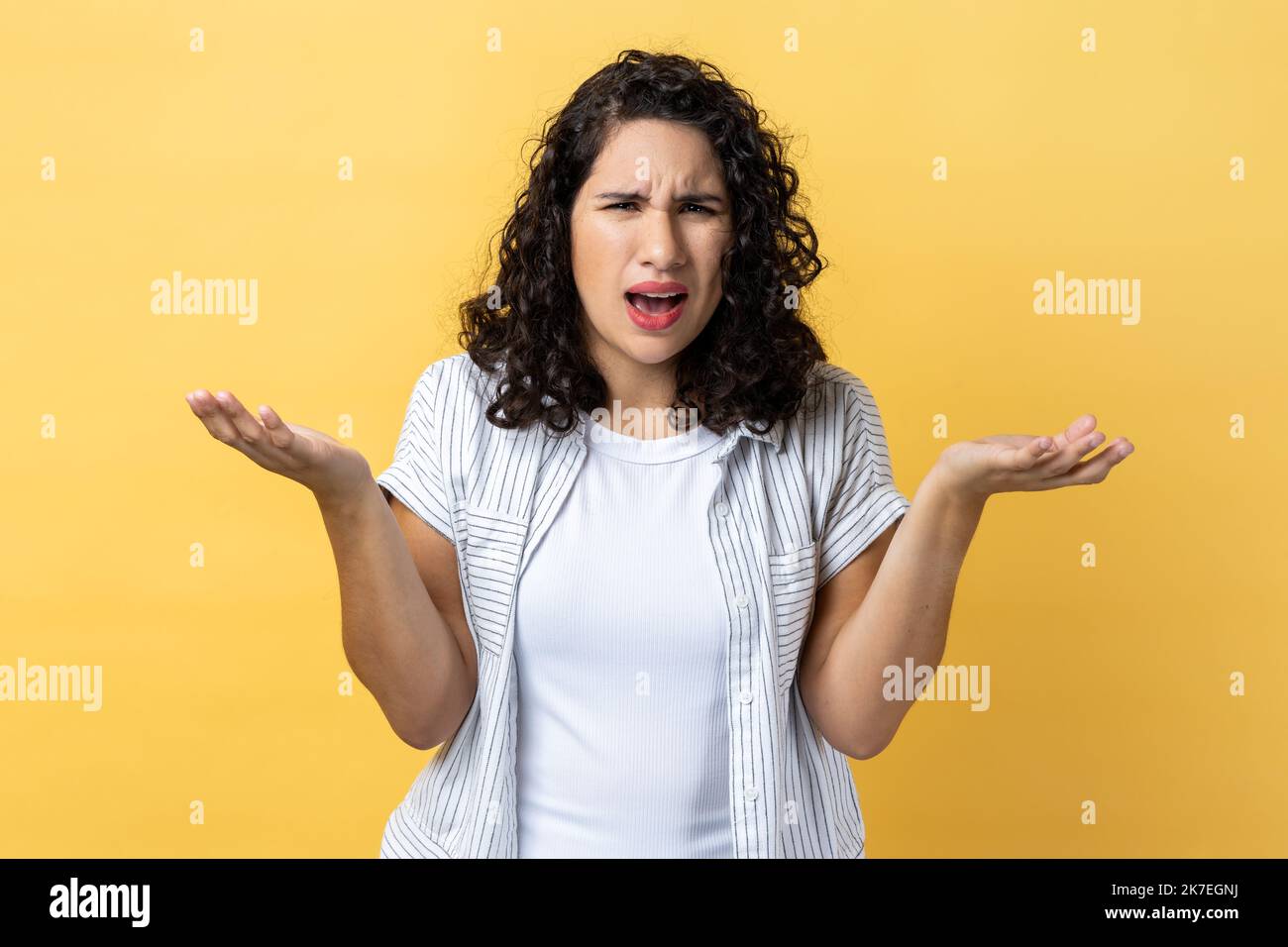 Portrait of unhappy stressed beautiful woman with dark wavy hair ...