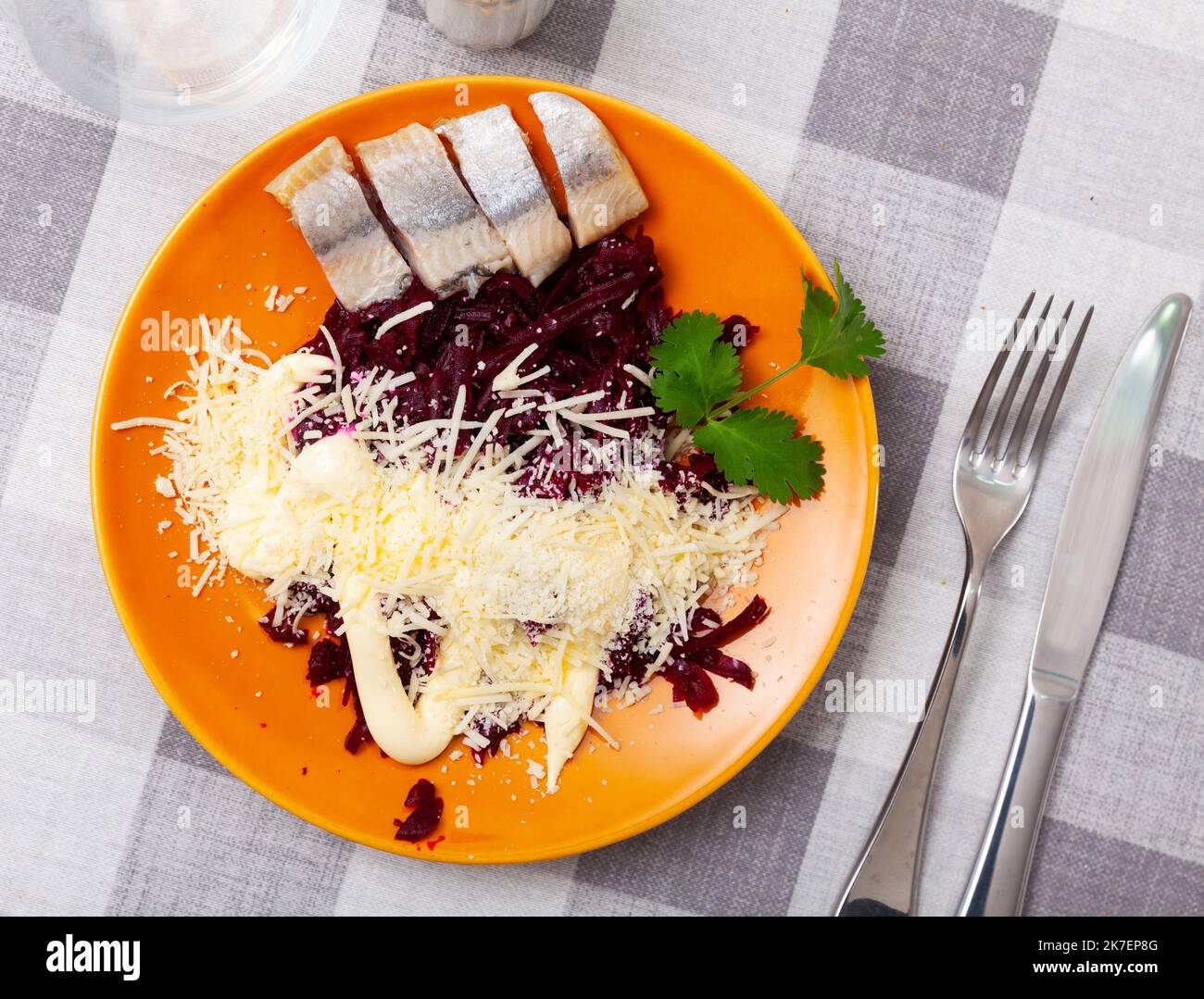 Beetroot served with cheese and pickled mackerel Stock Photo - Alamy
