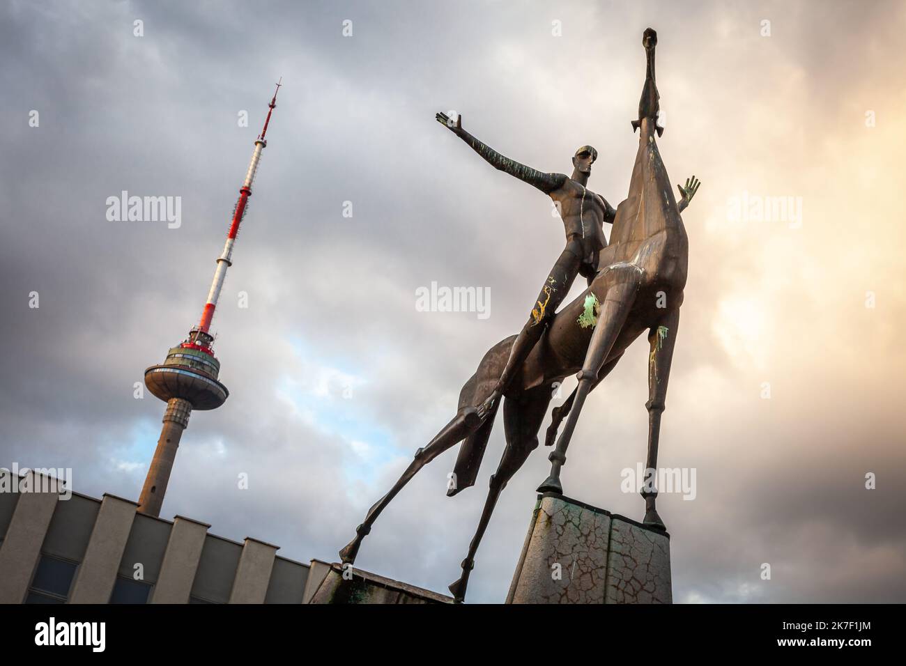 Lazdynai district of Vilnius with tv tower and horse man at sunset ...