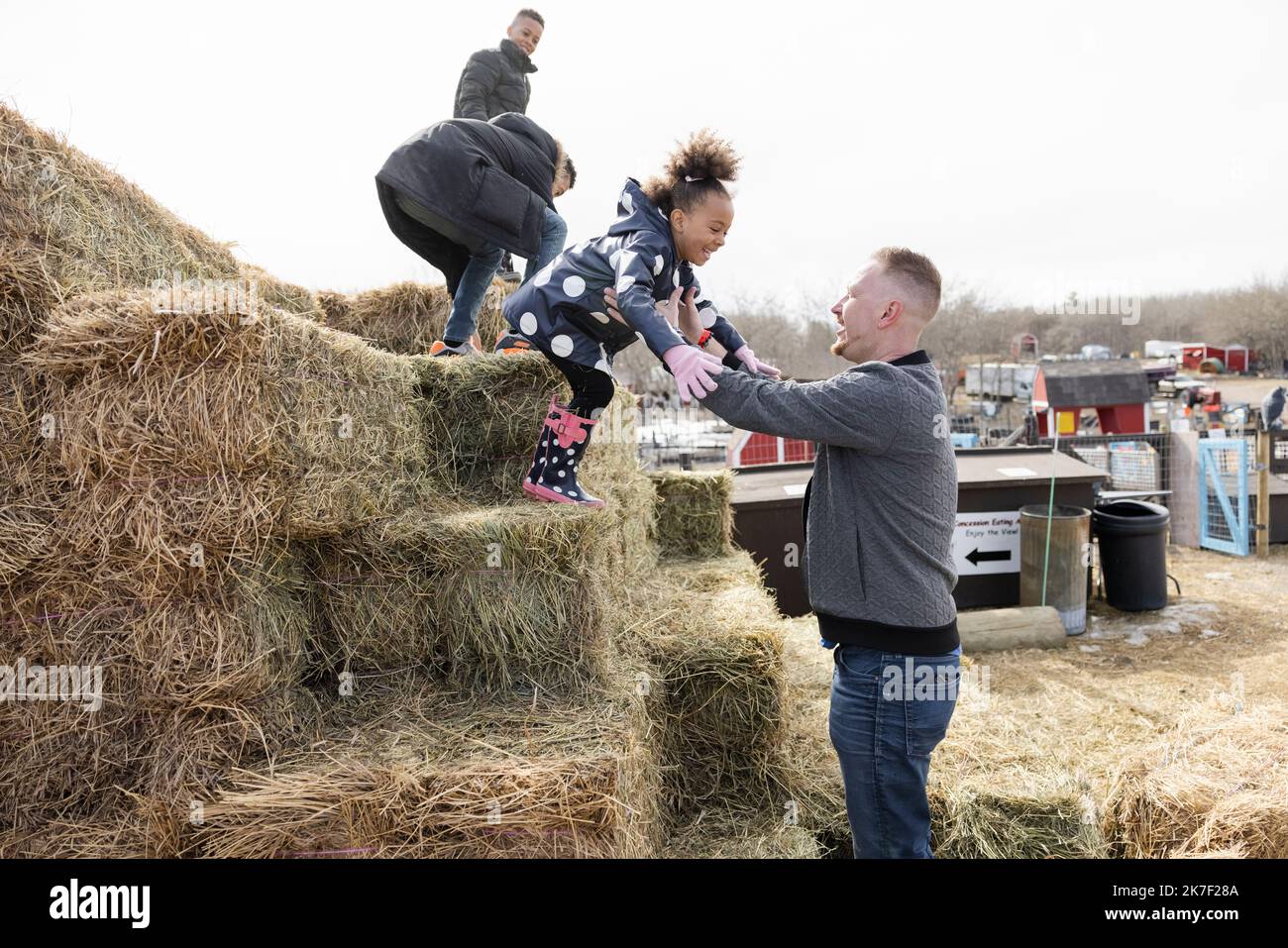 Child jumping on hay in hi-res stock photography and images - Alamy