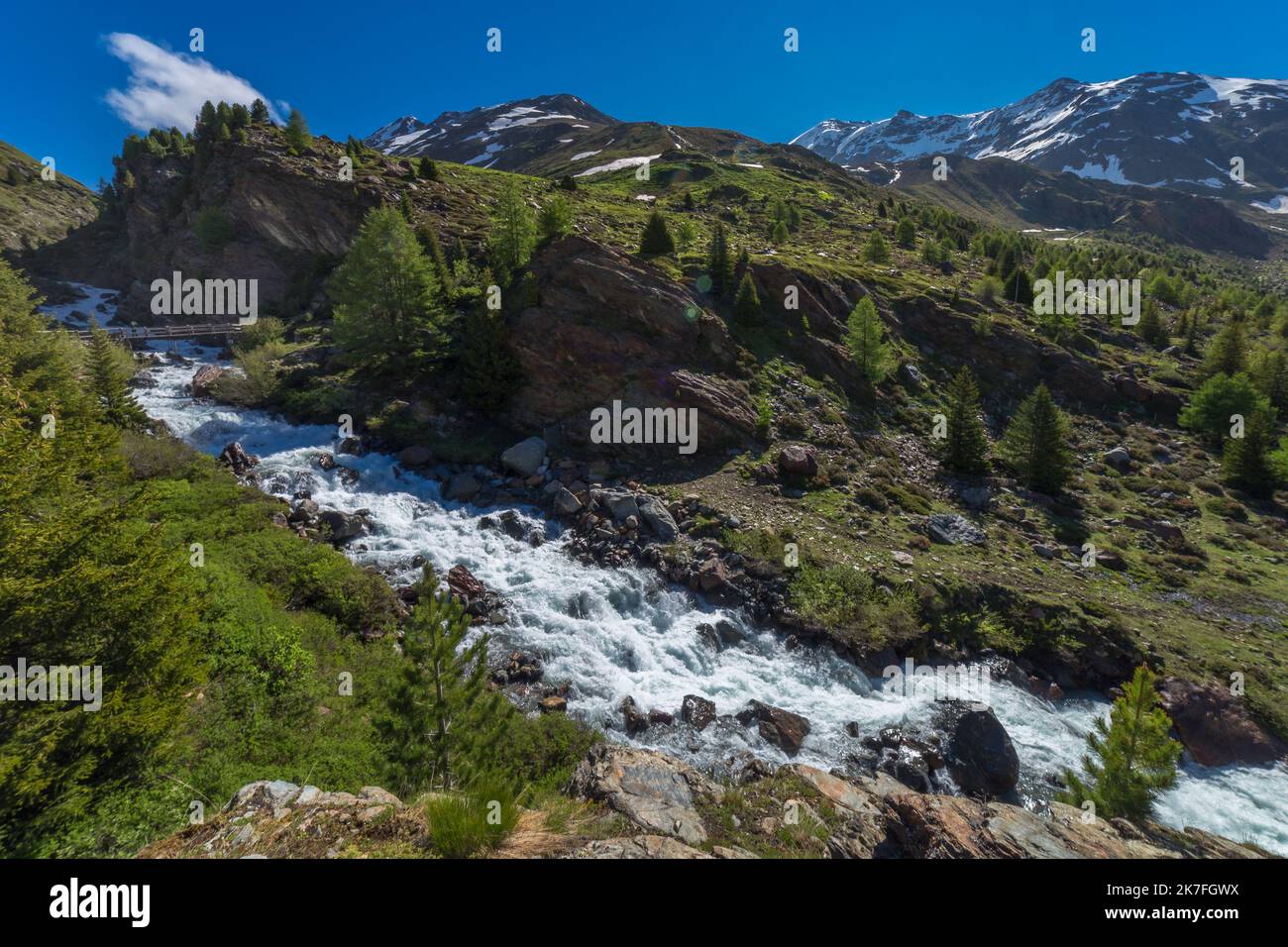 River stream in the mountains, Stelvio national park at clear sky ...