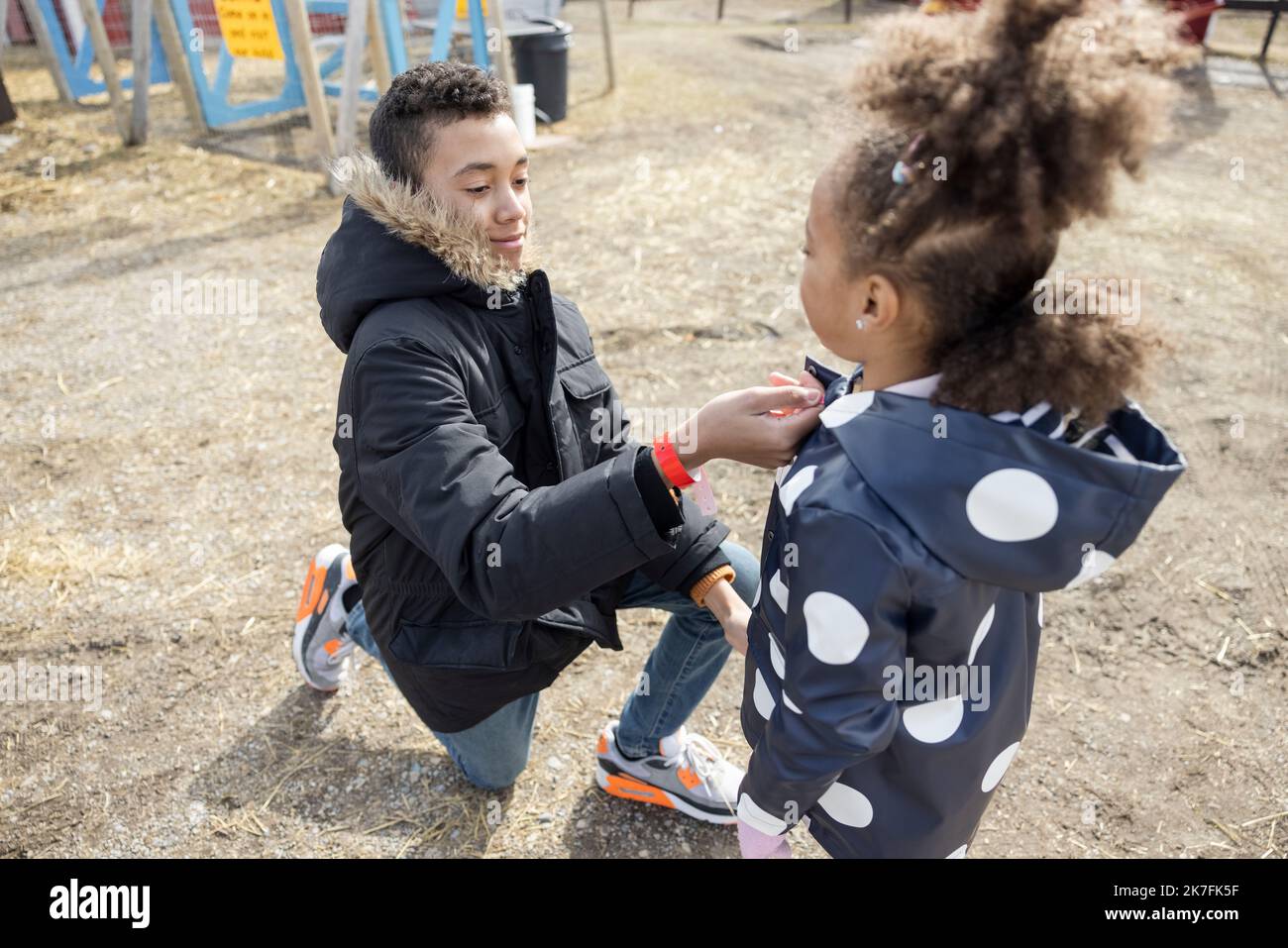 Child Zipping Coat Clipart