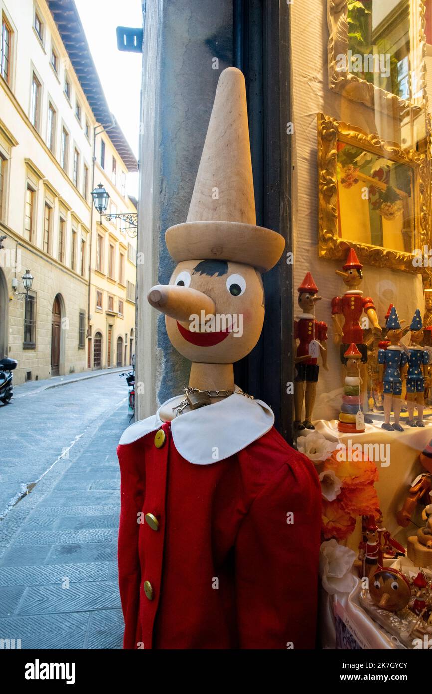 A Pinocchio wood statue outside a toys shop in Florence, Italy Stock ...