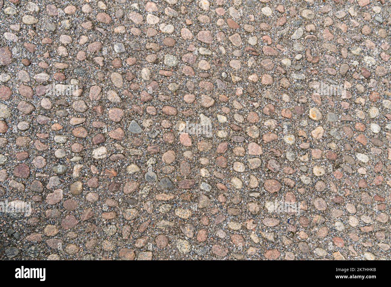 Old pavement of granite background. Top view on stone road close up ...