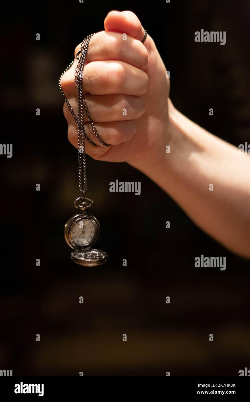 Dangling pocket watch hi-res stock photography and images - Alamy