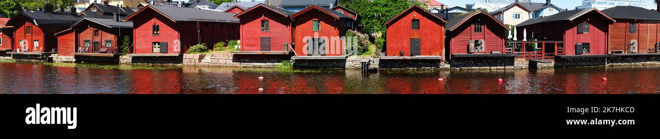Red harbor warehouses with nice reflections on porvoo river. fishing ...