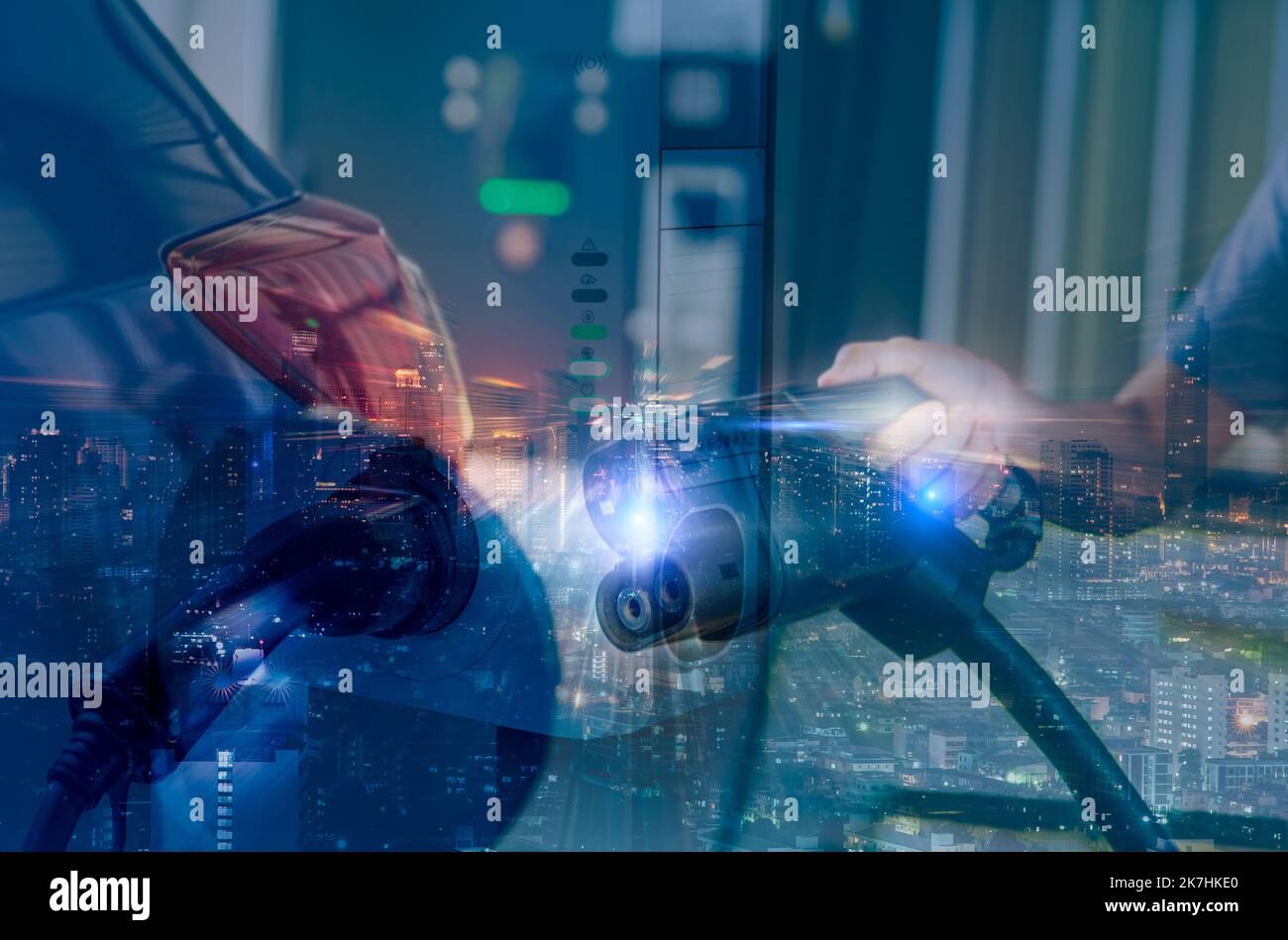 Car charging at electric car charging station and city night lights ...