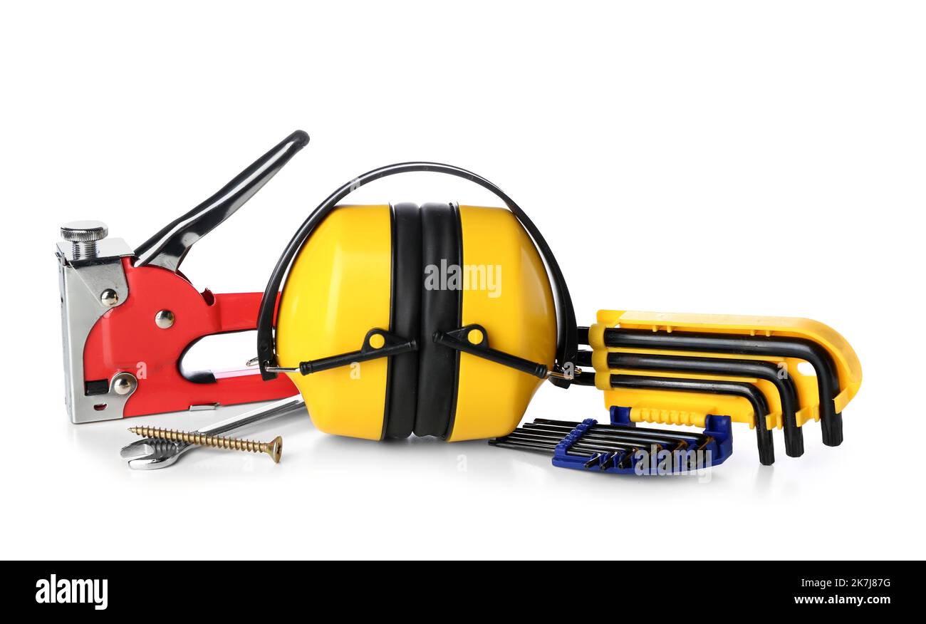 Hearing protectors with builder's tools on white background Stock Photo ...