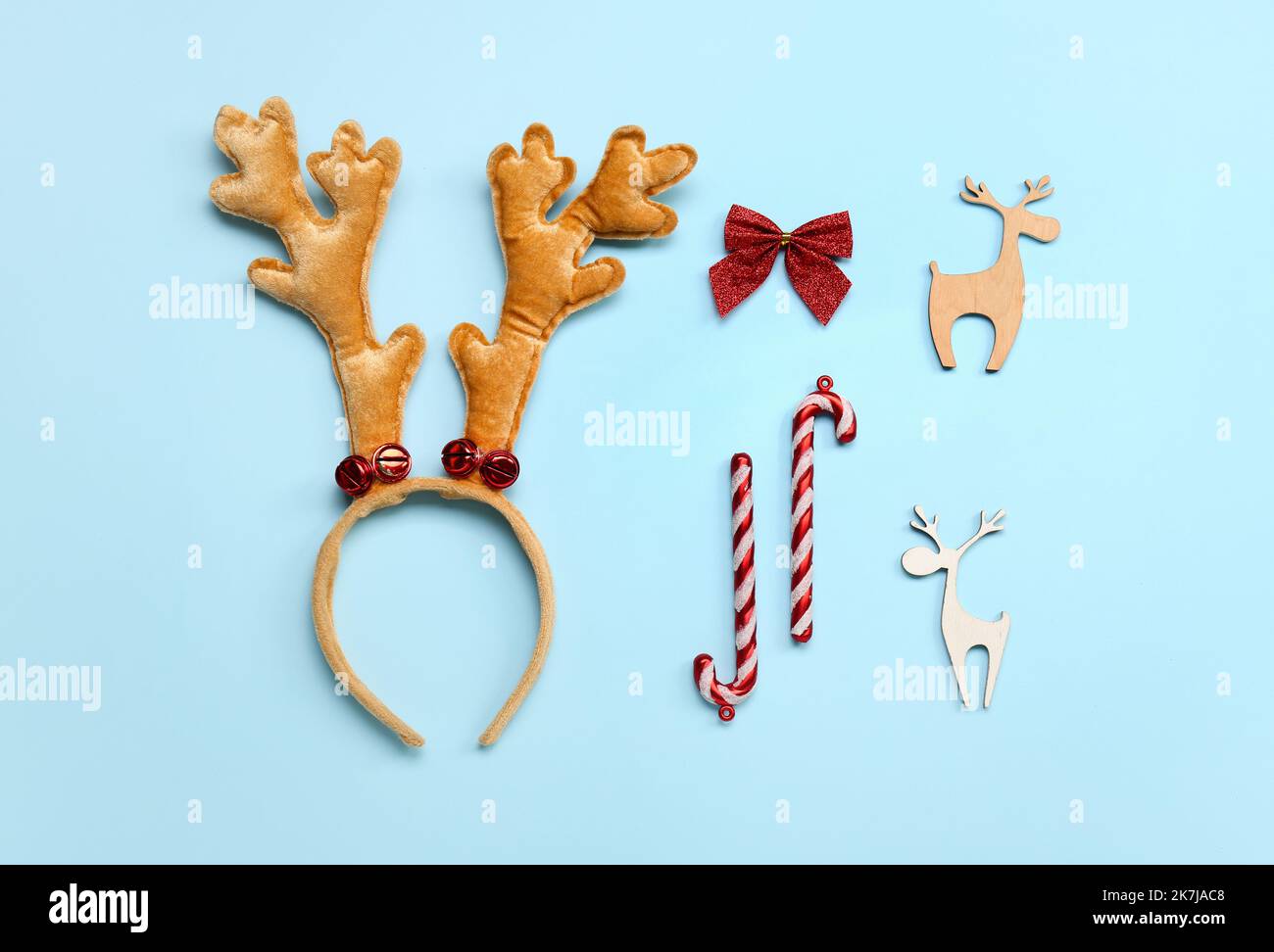 Different Christmas decor with reindeer horns on color background Stock ...