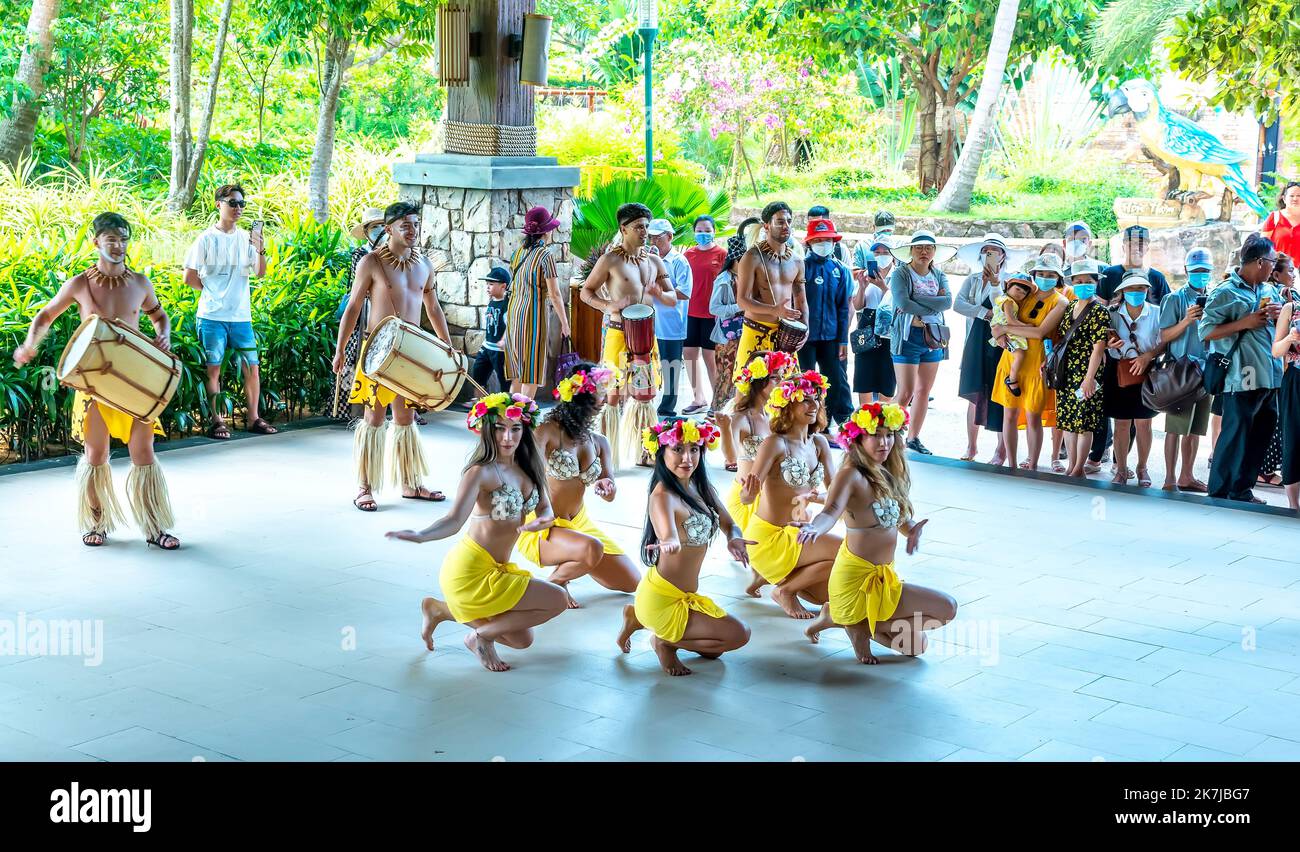 A group of Latin American performers dance sports in swimsuits to serve ...