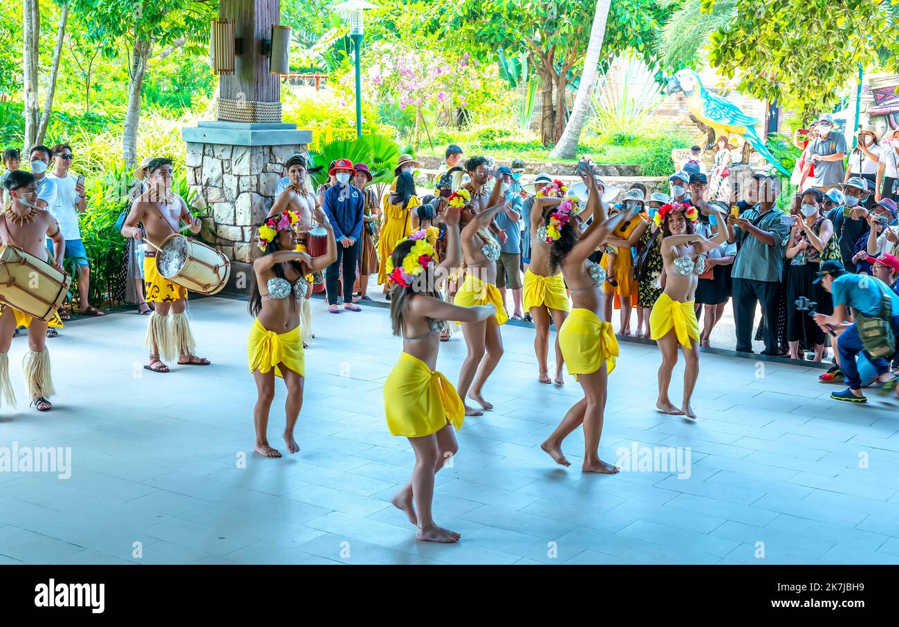A group of Latin American performers dance sports in swimsuits to serve ...