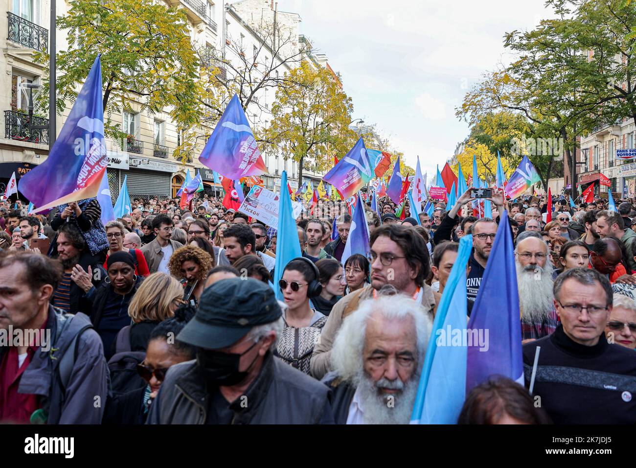 Paris, France. 16th Oct, 2022. Protesters wave flags during the ...