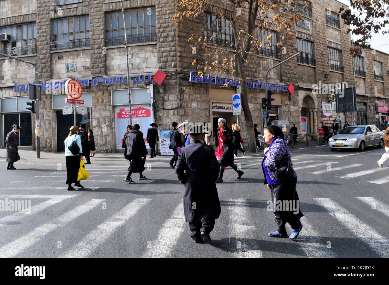 Pedestrians crossing the road at the ultra-Orthodox neighborhood of ...