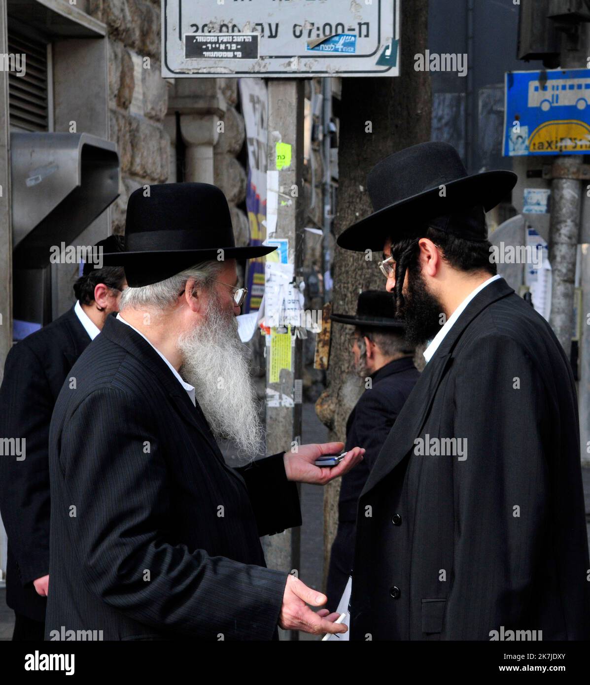 Haredi Jewish men socializing in the Geula ultra-Orthodox neighborhood ...