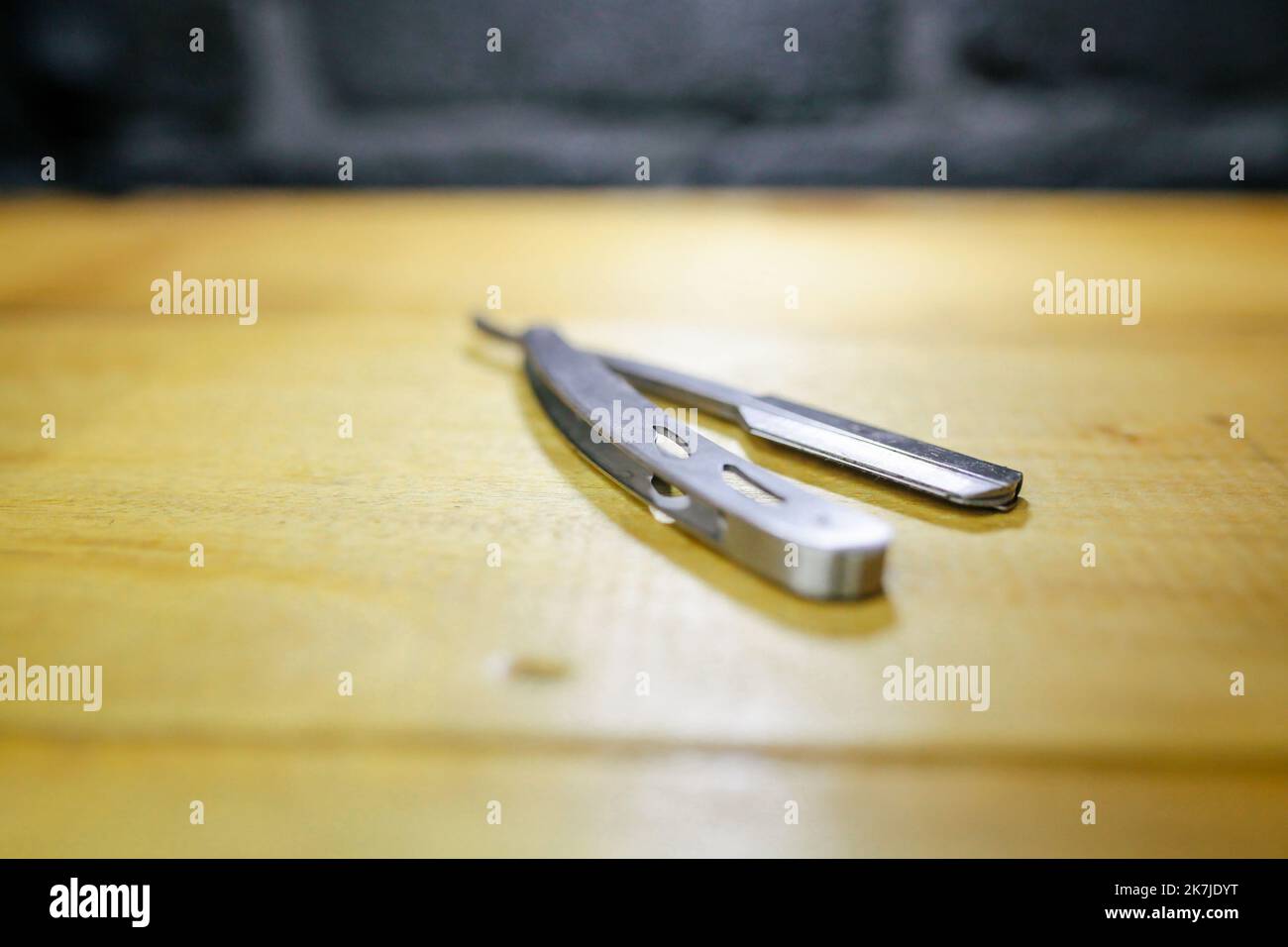 Open old dangerous razor on a wooden background. isolated, blade Stock ...