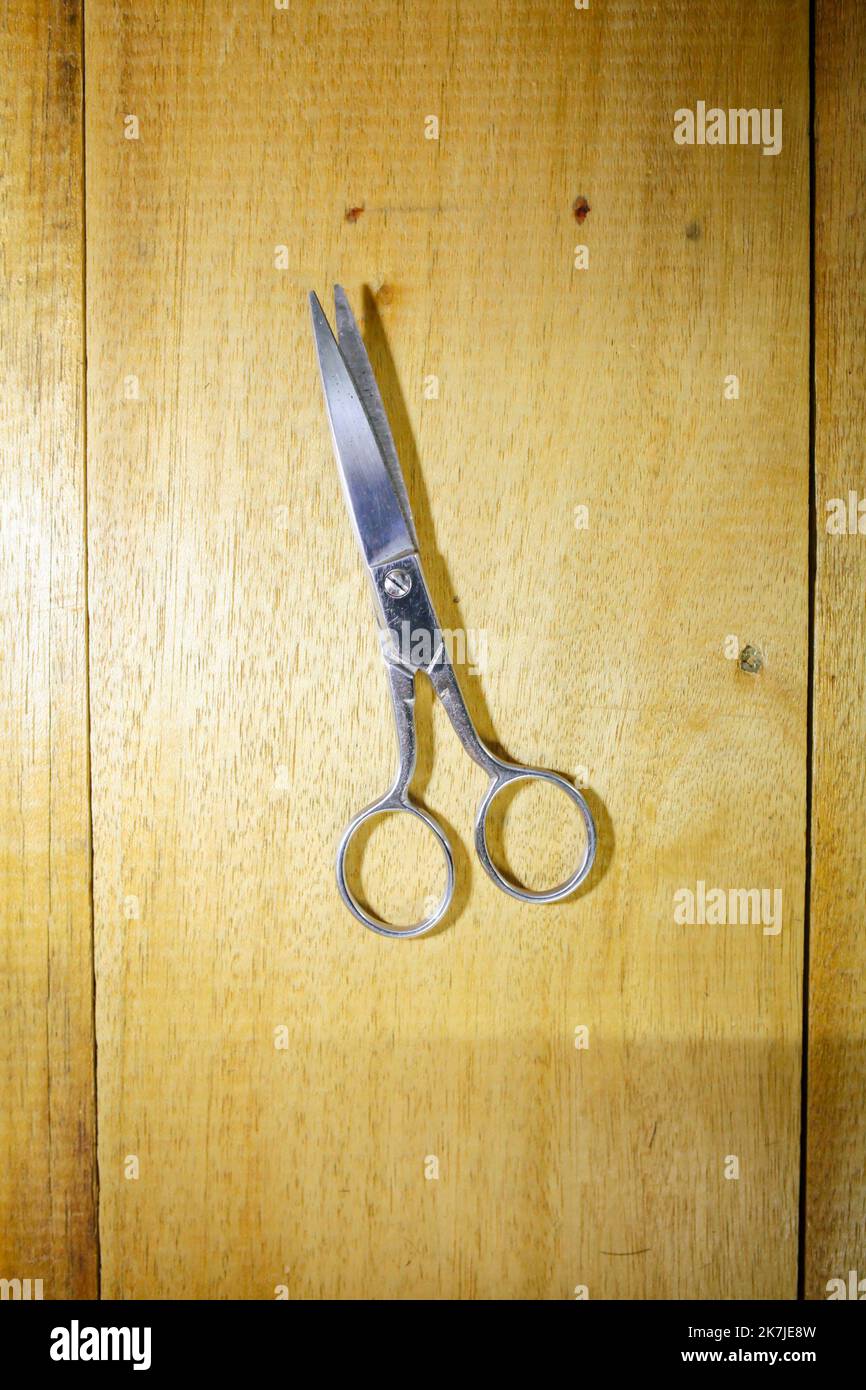 Barber scissors wooden background Stock Photo - Alamy